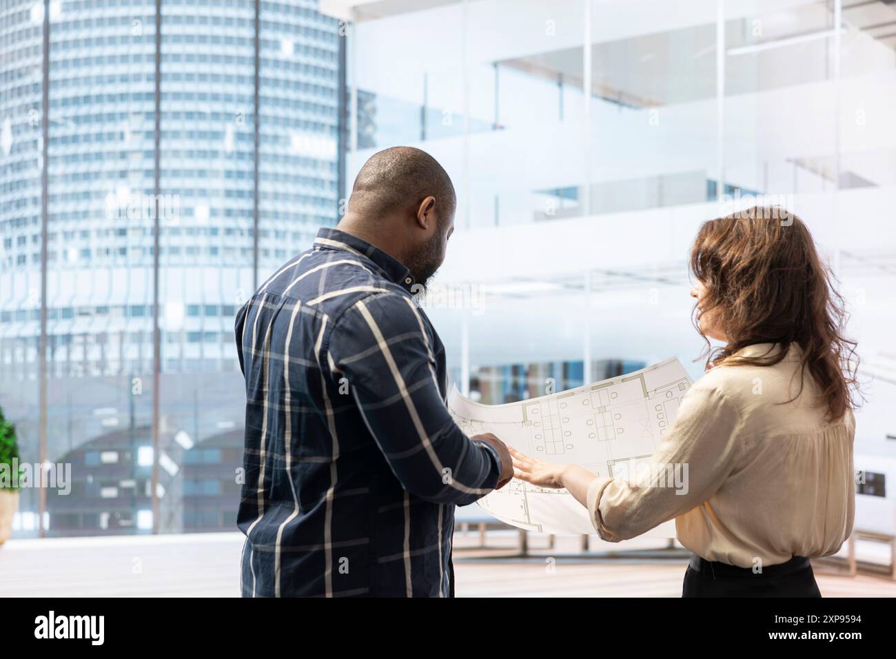 Realtor and businessman collaborating on a real estate investment ...