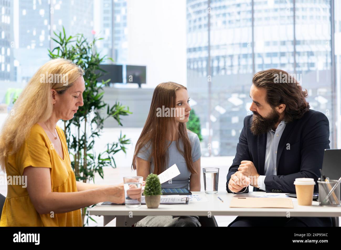 Financial advisor discussing with clients about importance of budgeting ...