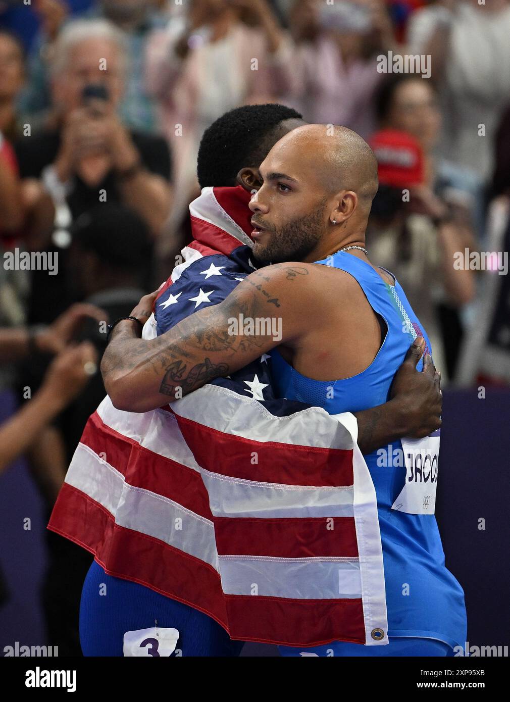 Paris, France. 4th Aug, 2024. Lamont Marcell Jacobs (R) of Italy hugs ...