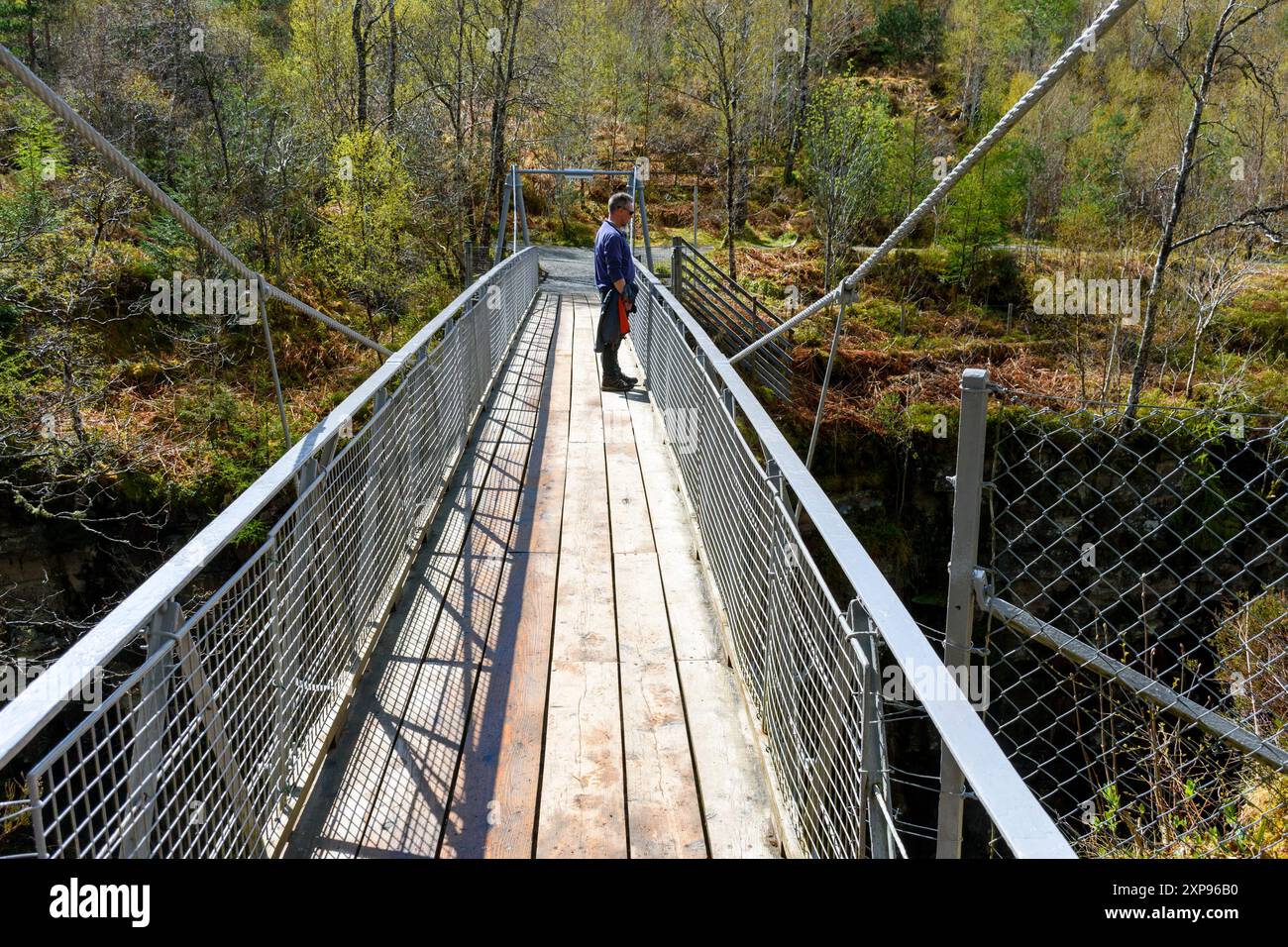 The footbridge at the Corrieshalloch Gorge on the Abhainn Droma river ...