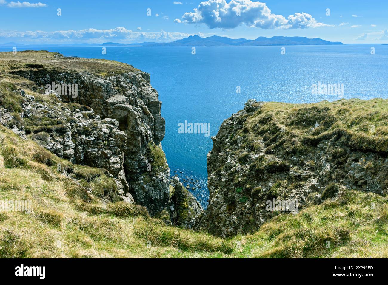 The Isle of Rum from the coastal cliff top walk below Beinn an Eòin on ...