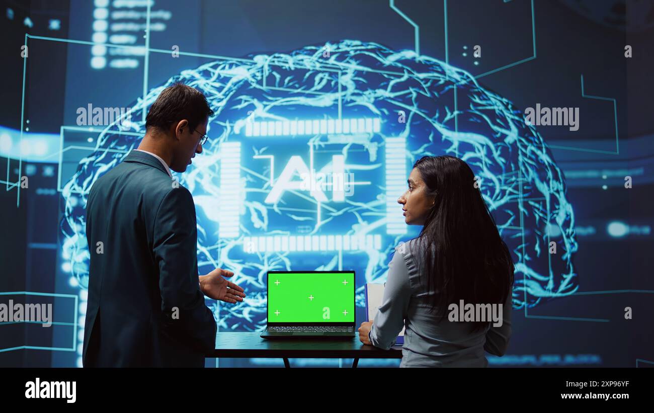 AI developers using isolated screen device for business data analysis. IT department staff ...