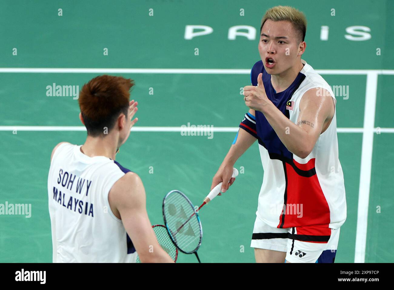 Paris, France. 4th Aug, 2024. Aaron Chia (R)/Wooi Yik Soh of Malaysia communicate during the ...