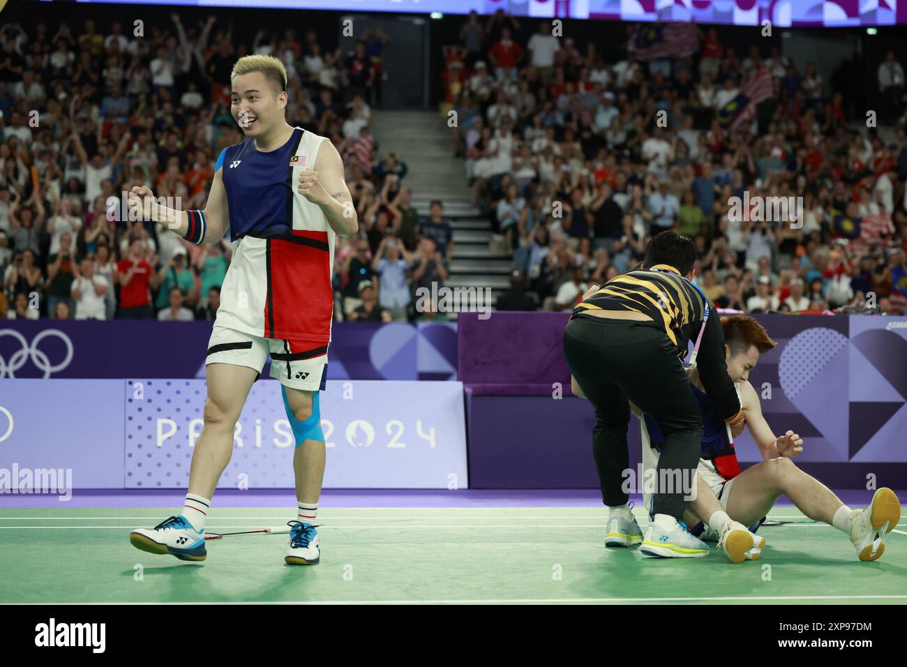 Paris, France. 4th Aug, 2024. Aaron Chia (L)/Wooi Yik Soh of Malaysia celebrate victory in the ...
