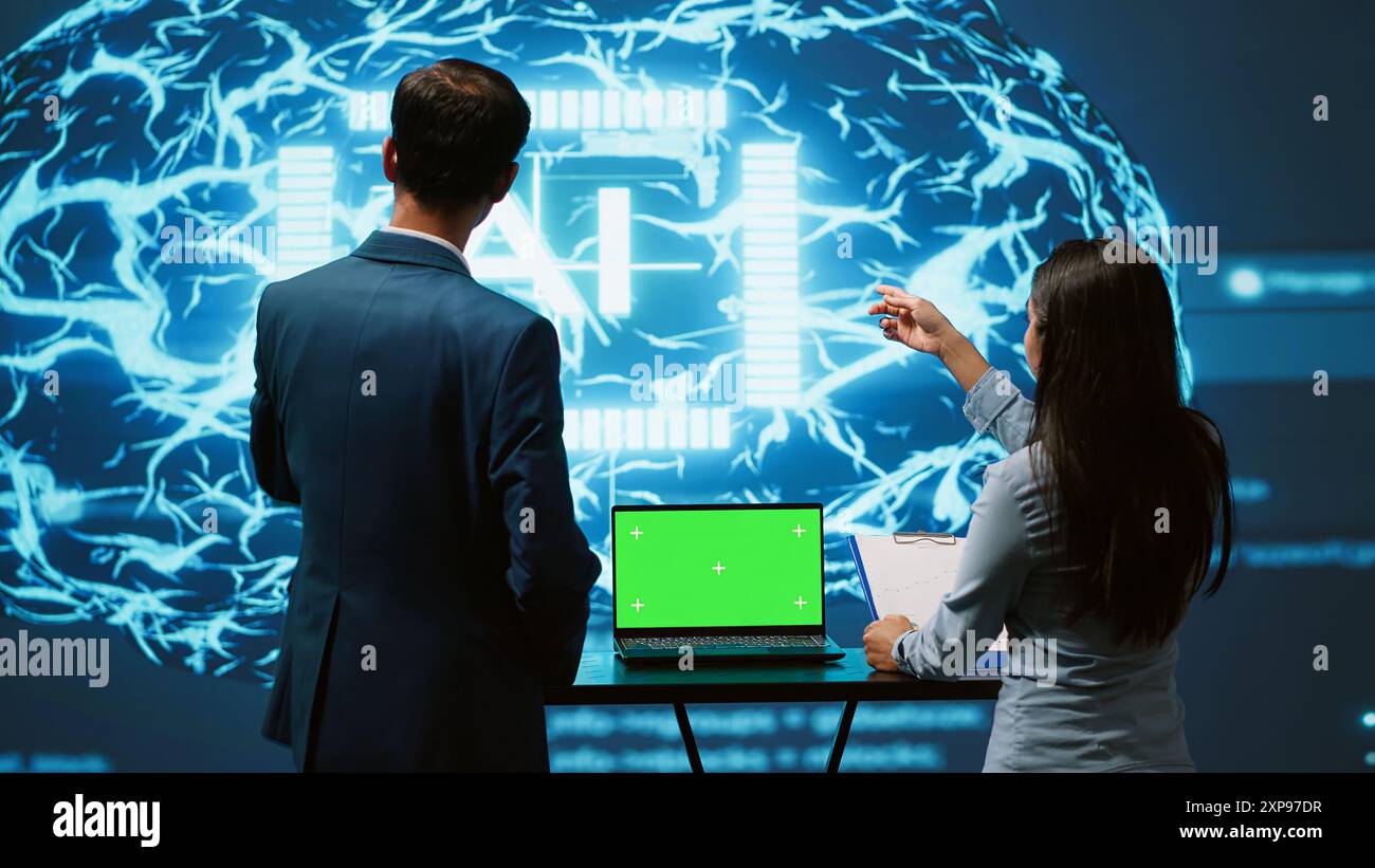 AI developers using isolated screen device for business data analysis. IT department staff ...