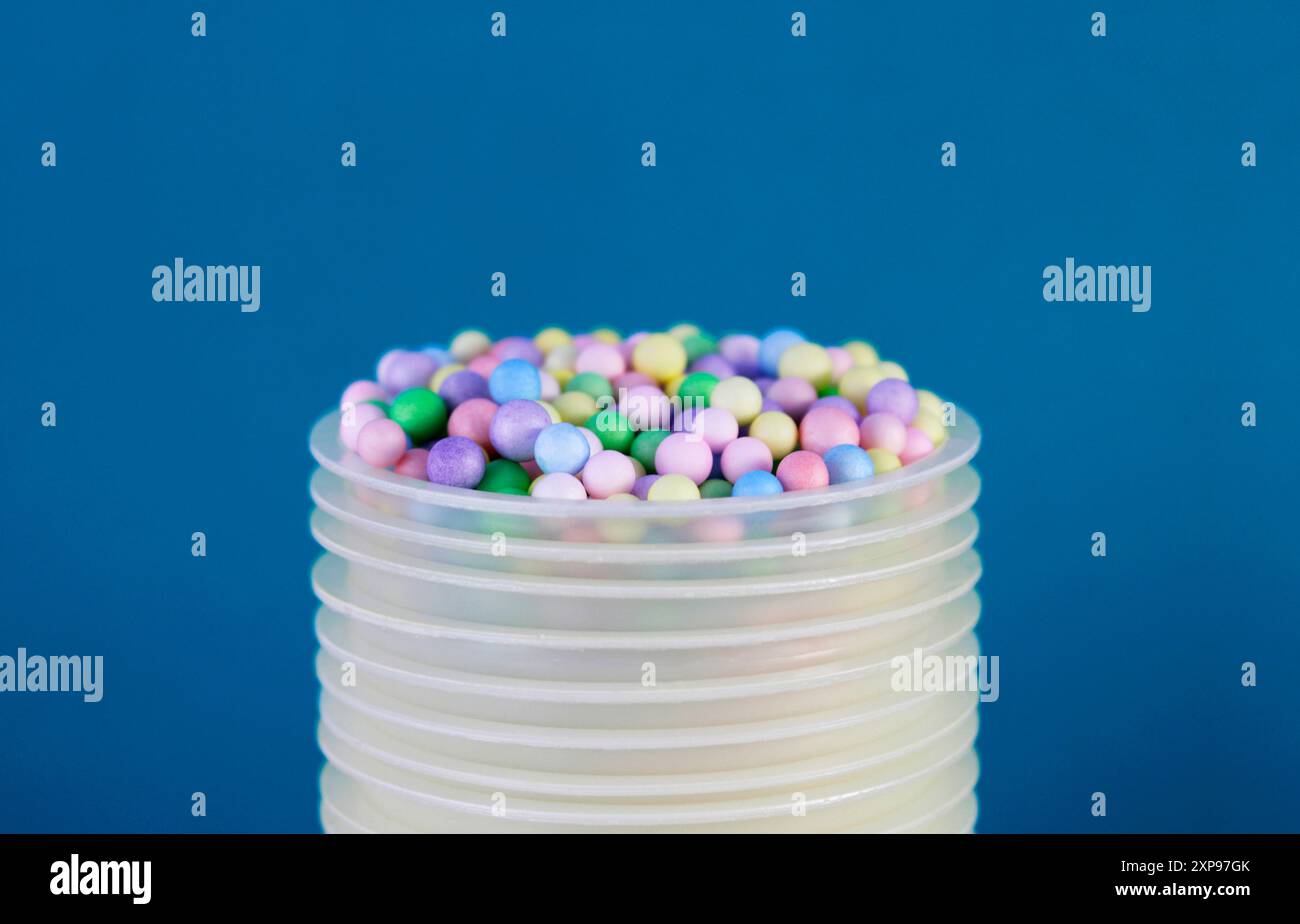 Colorful spheres inside a plastic container Stock Photo - Alamy