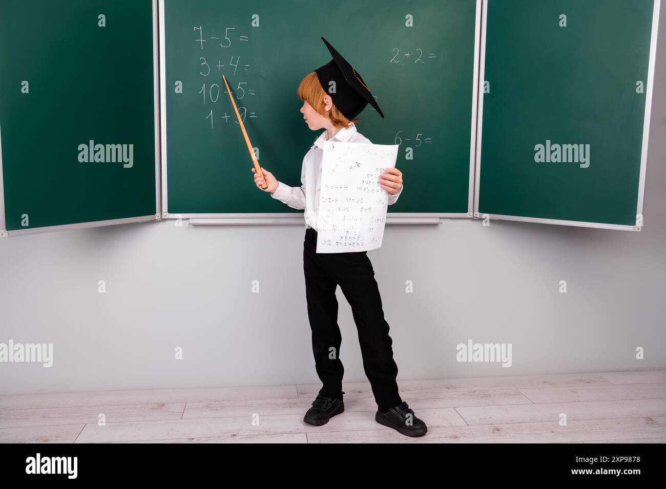 Full body photo of cute little schoolboy graduation hat teacher hold ...