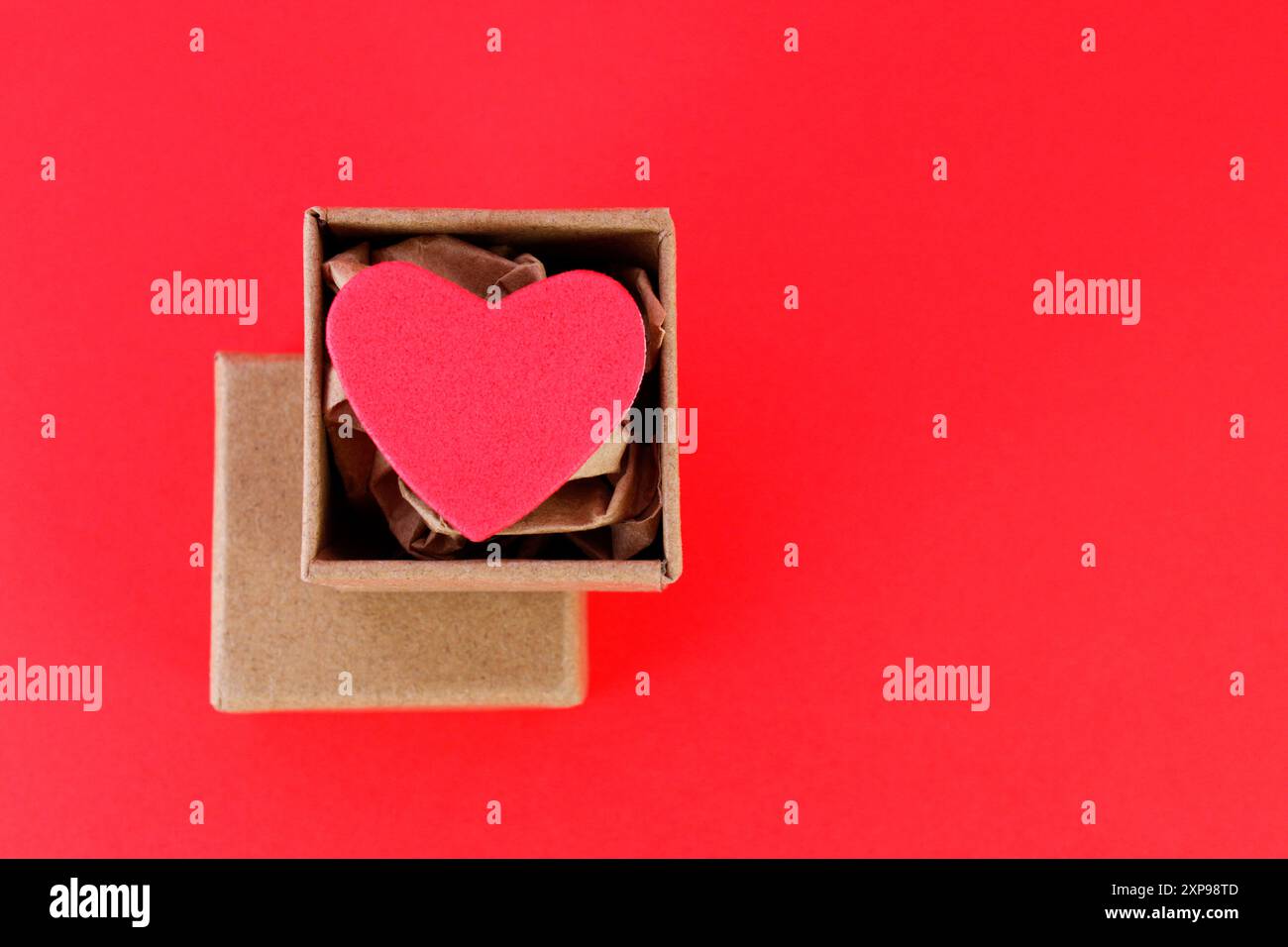 Heart carefully packed in a handmade gift box Stock Photo - Alamy