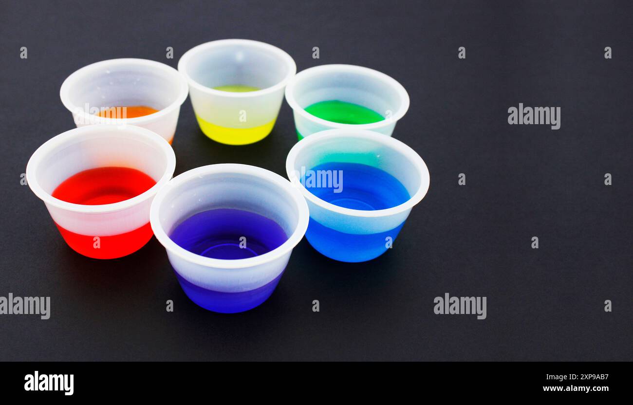 Plastic containers with liquid forming a color circle Stock Photo - Alamy