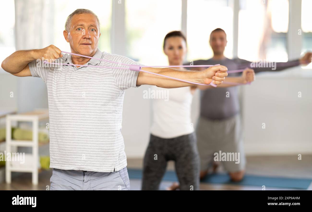 Mature man bring together and spread your straightened arms at chest ...
