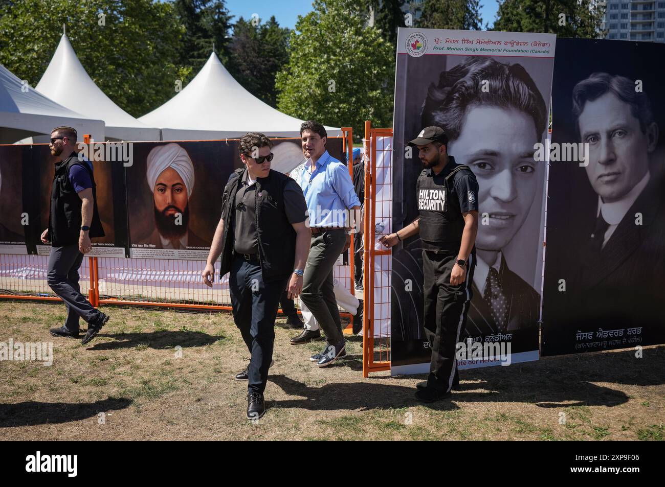 Prime Minister Justin Trudeau walks with his RCMP security detail as he ...