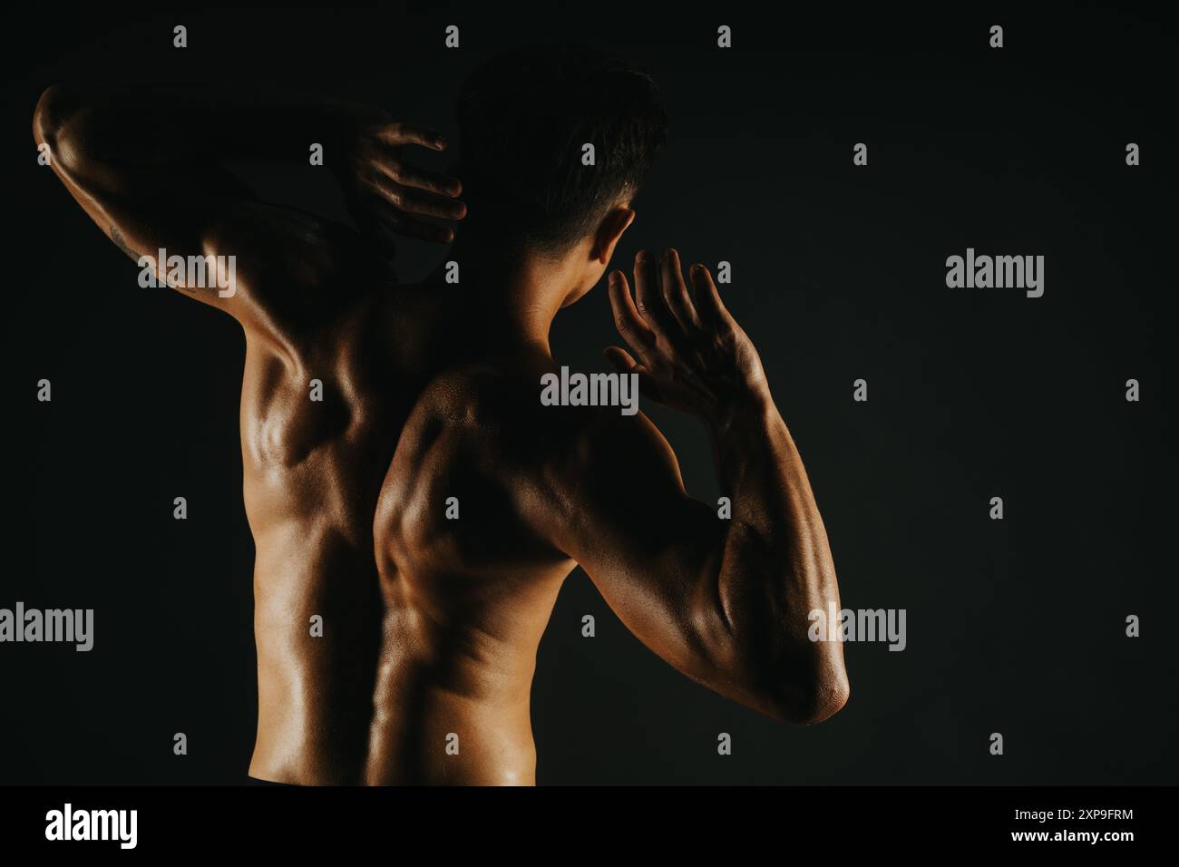 Back pose muscular man showing hi-res stock photography and images - Alamy