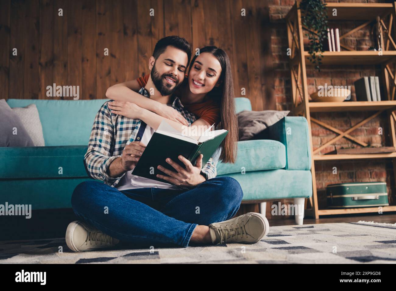 Full length photo of attractive cheerful cuddle read book married young ...