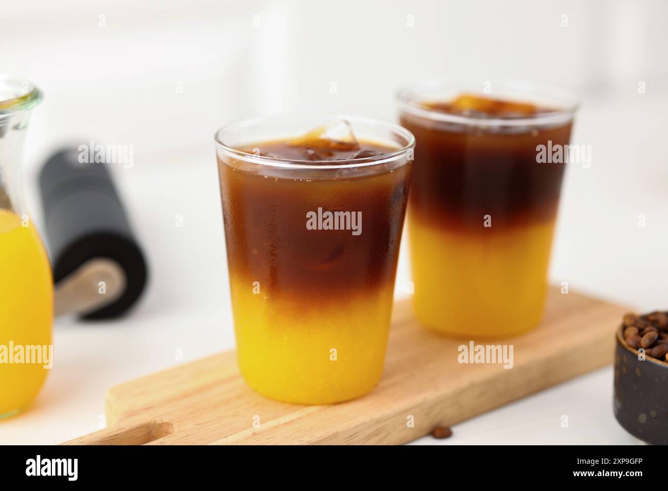 Iced Americano Black Coffee and Layer of Orange and Lemon Juice Stock ...
