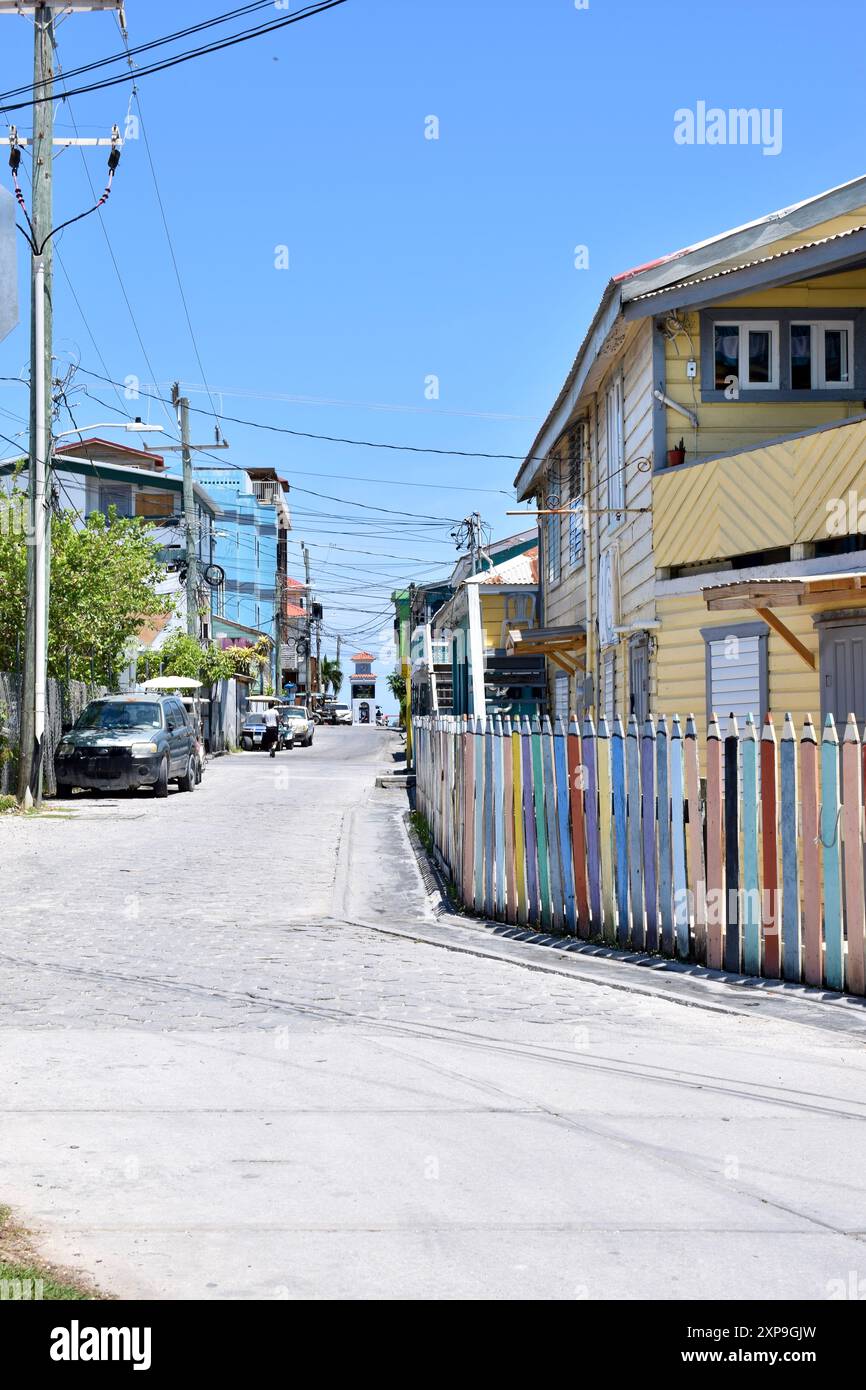 A colorful fence in a side street of San Pedro Town on Ambergris Caye ...