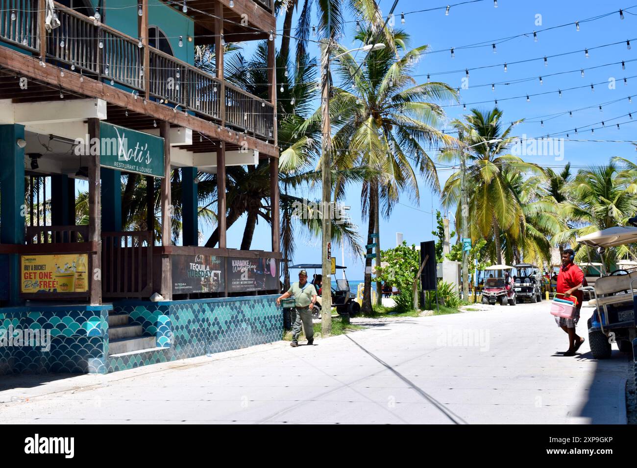 Local people in a street in the Boca del Rio area of San Pedro, Belize ...