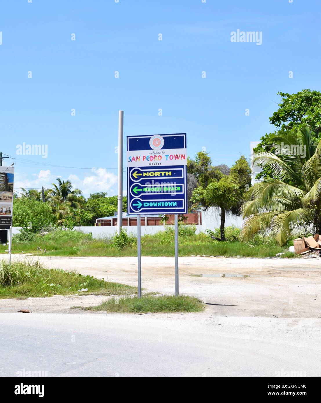 A welcome sign indicating the directions for north Ambergris Caye ...