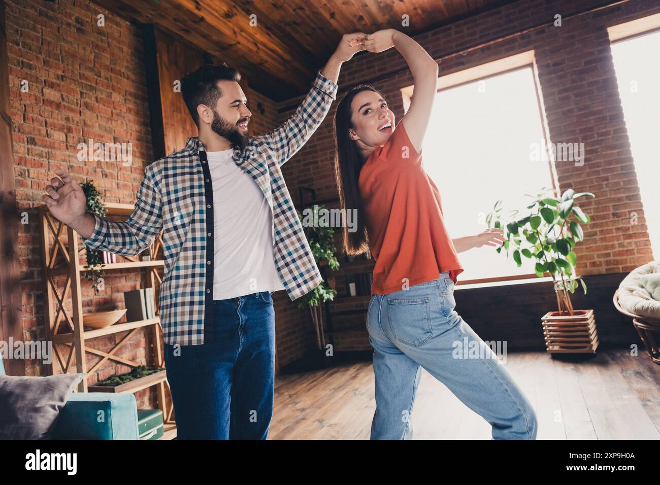 Photo of cheerful cute young couple dancing cuddle enjoy weekend have ...