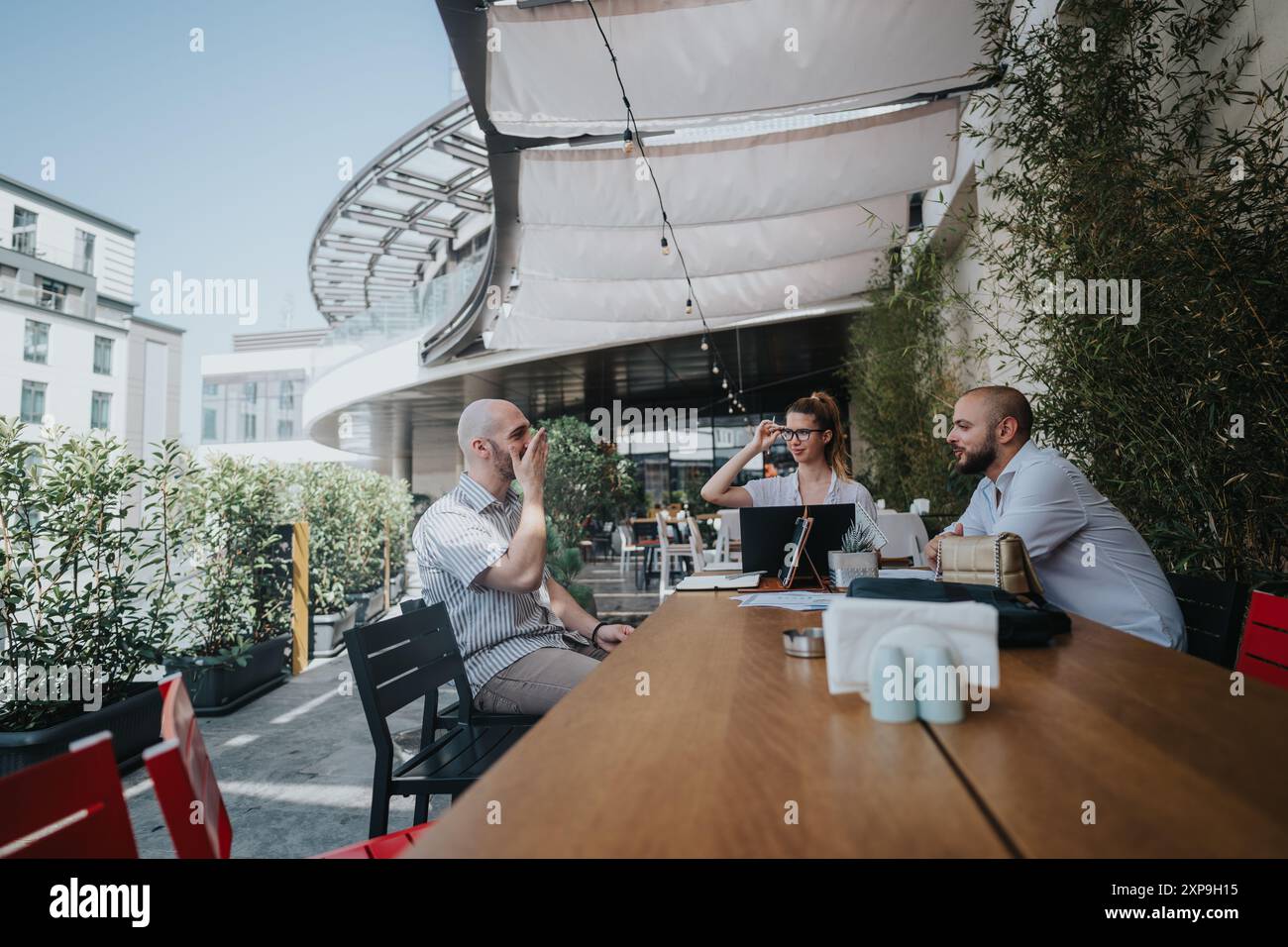 Young business entrepreneurs strategizing and collaborating in an ...