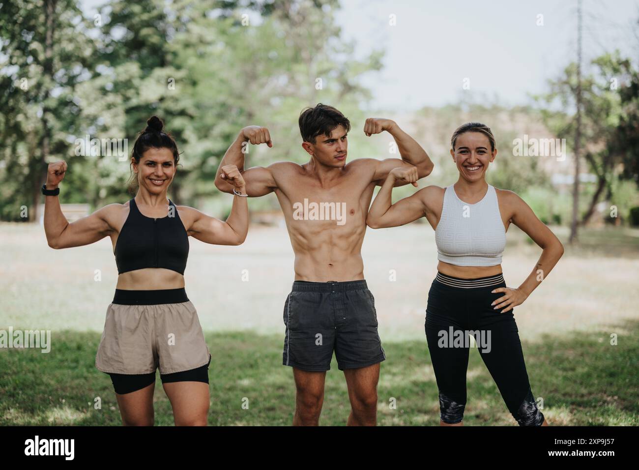 Group friends flexing muscles together hi-res stock photography and ...
