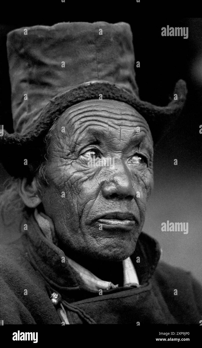 A Ladakhi man wearing traditional dress comes to see the Cham dances at ...