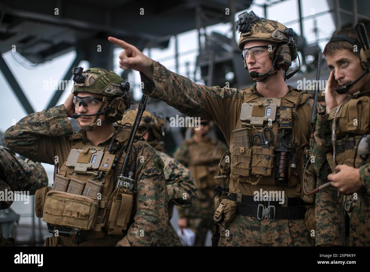 U.S. Marines Corps Sgt. Kyle Stark, center, a squad leader assigned to ...