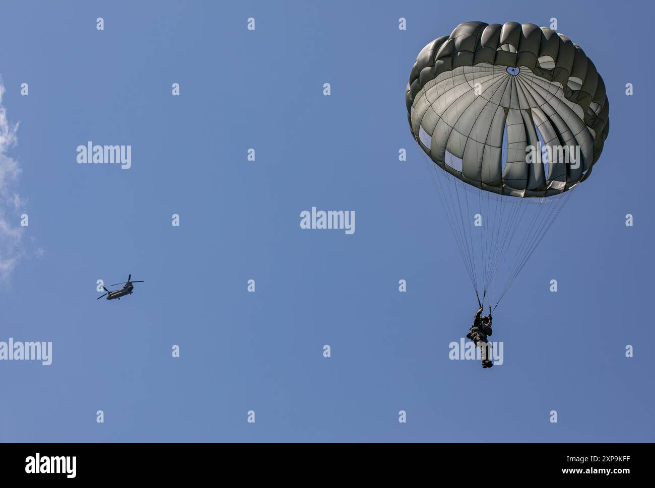 A German Paratrooper descends to drop zone using their MC-6 Parachute ...