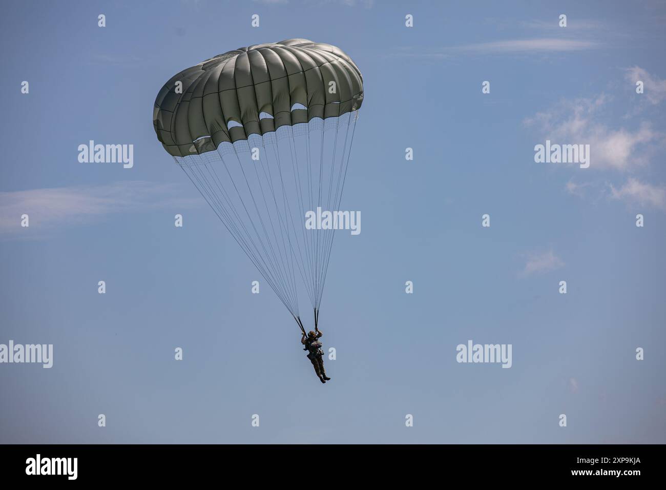 A German Paratrooper descends to drop zone using their MC-6 Parachute ...