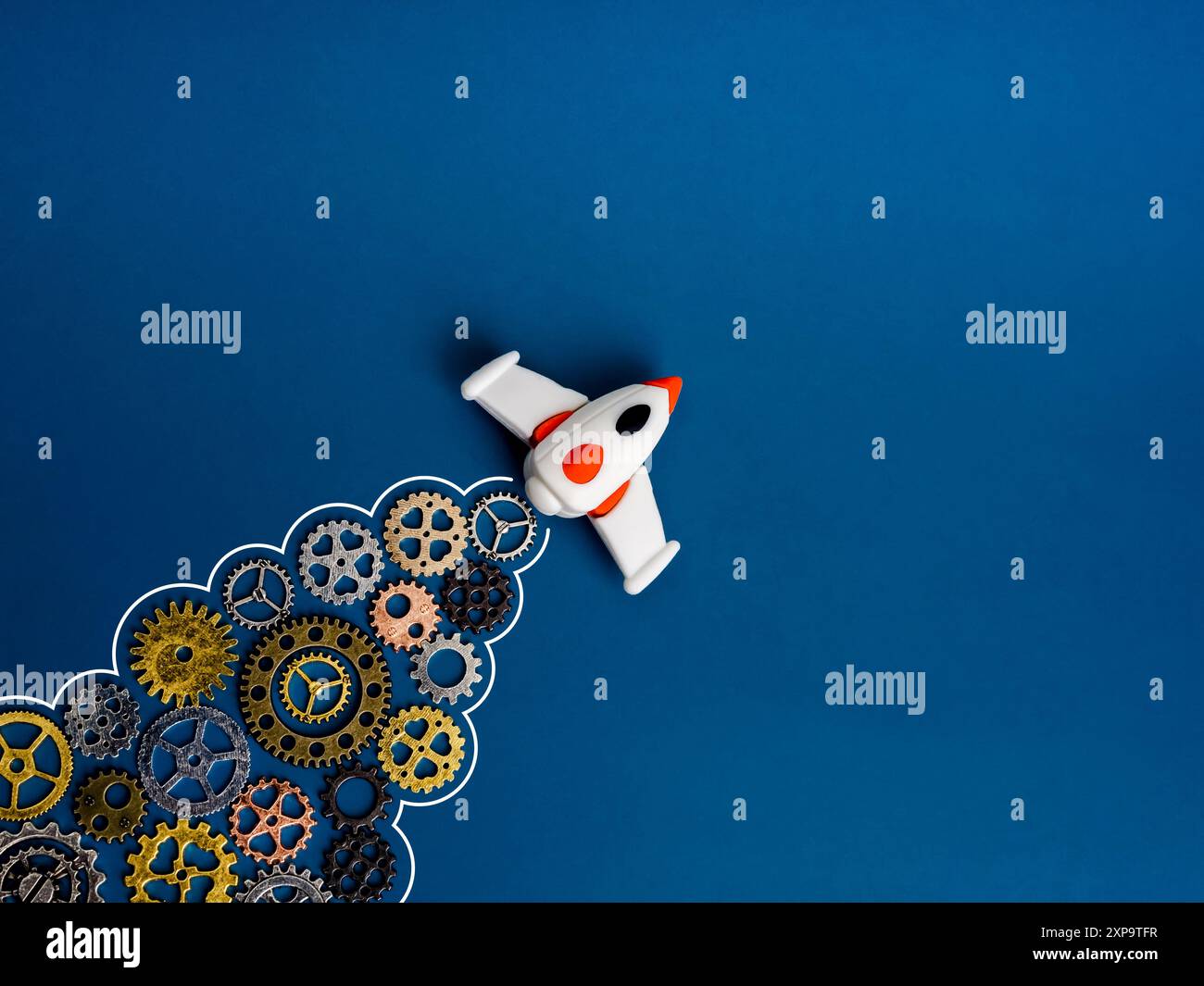 White spaceship rocket fly with many cog gears as jet smoke on blue ...