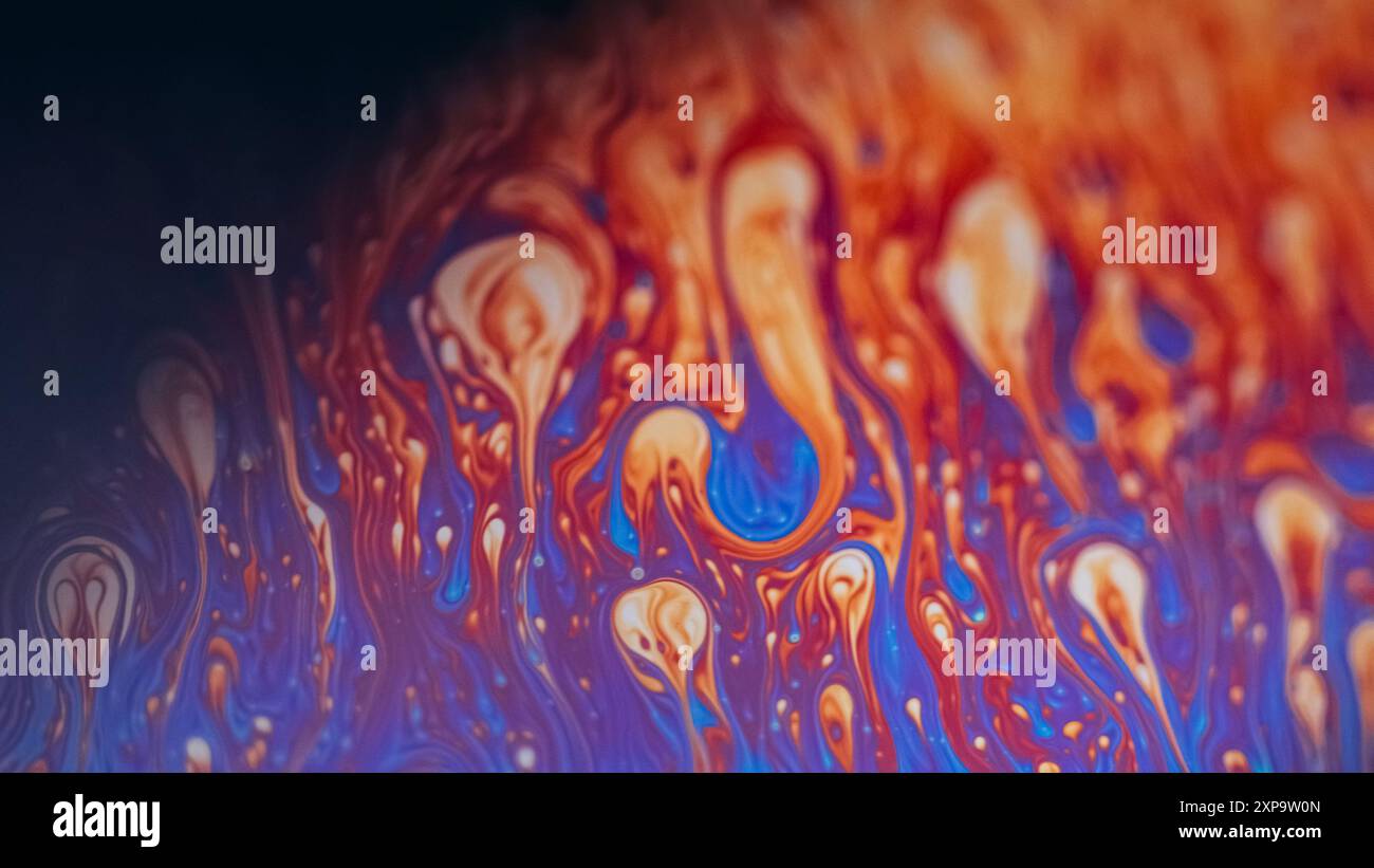 Paint spill. Blur ink mix. Defocused blue orange color acrylic dye ...