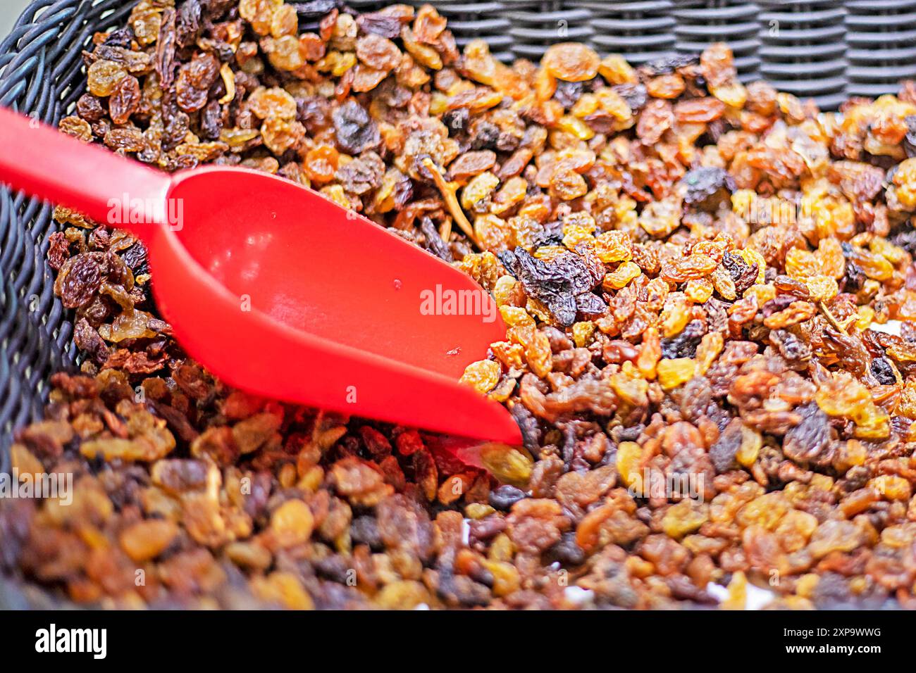 white raisins in a container in a supermarket in bulk. Glucose and ...