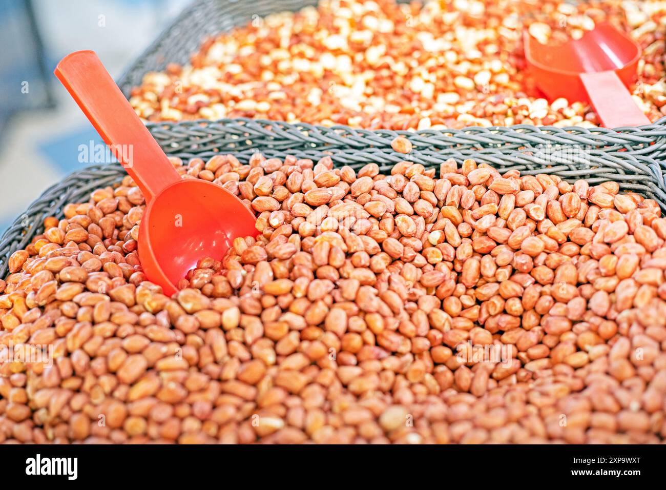 abstract background of ripe peeled peanuts in bulk in a supermarket ...