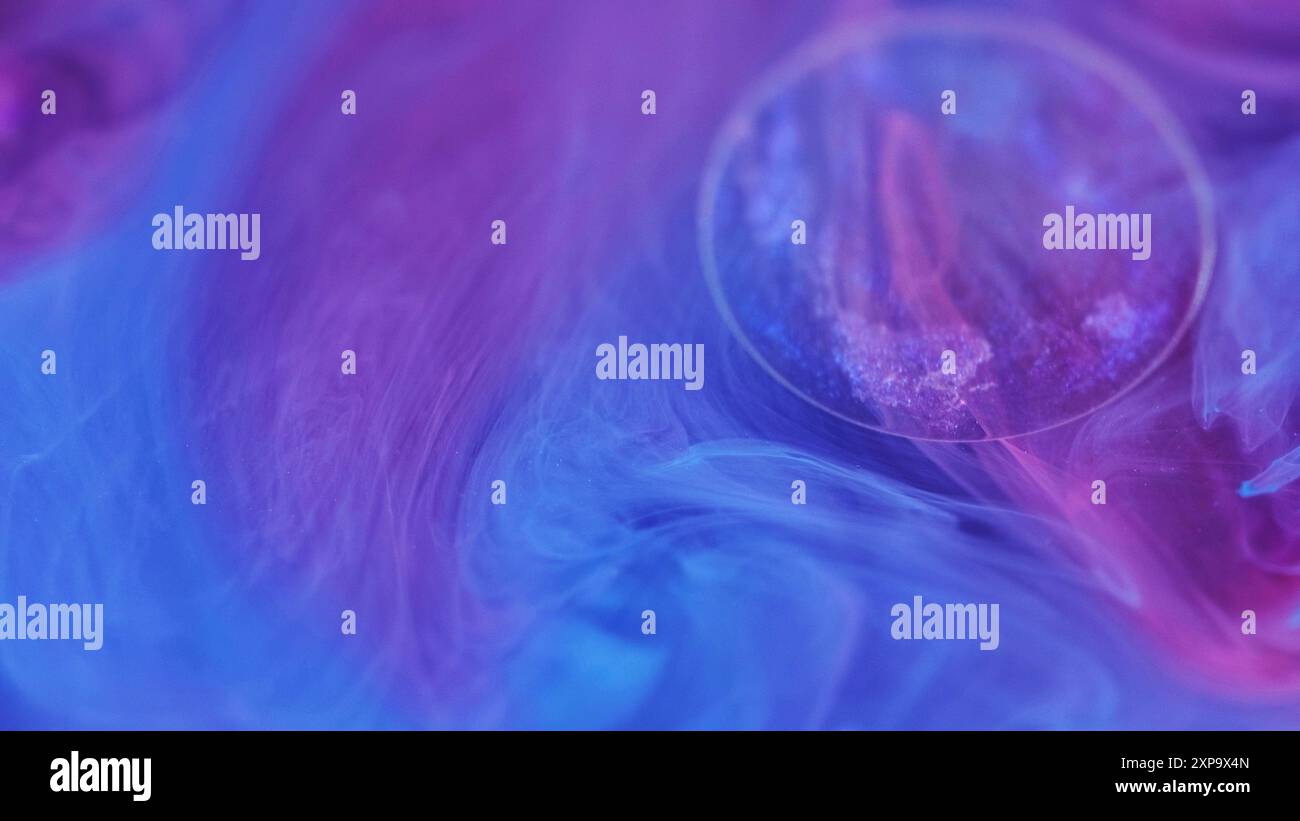 Ink water. Fantasy paint. Glossy liquid. Defocused blue pink color ...