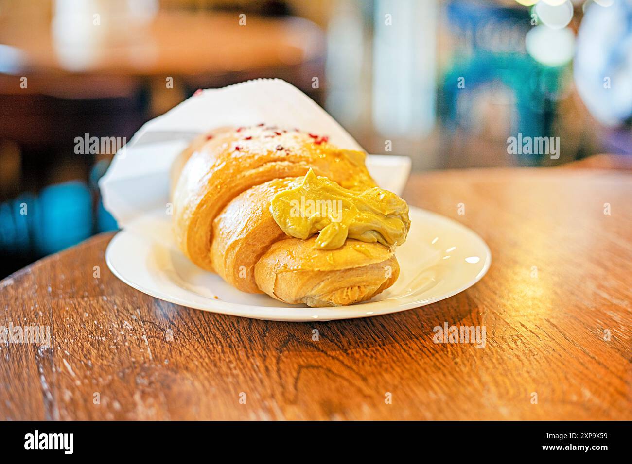 hot croissant with pistachio cream on the table. Back to school. snack ...