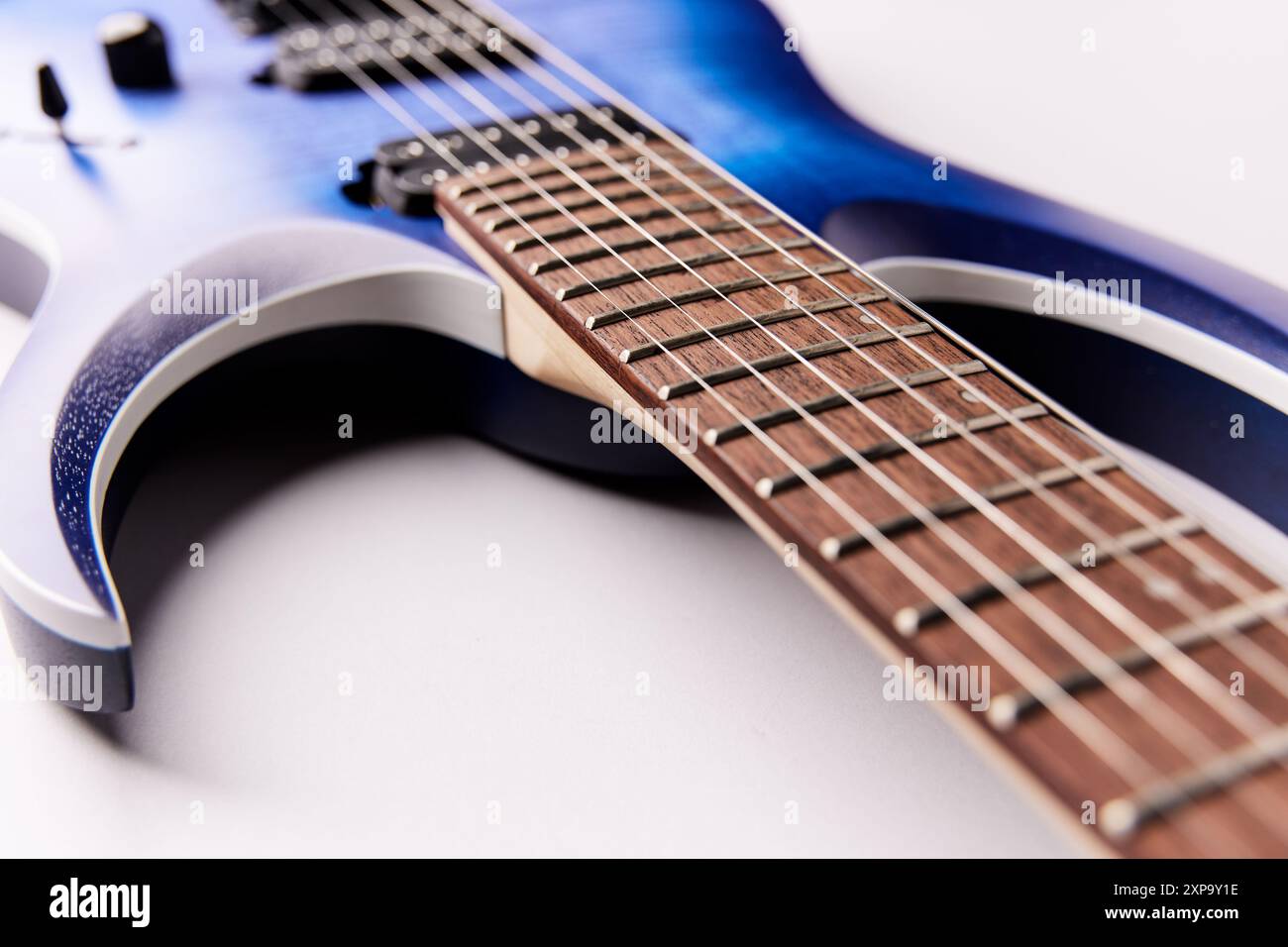 Fretboard of modern electric guitar. Close up Stock Photo - Alamy
