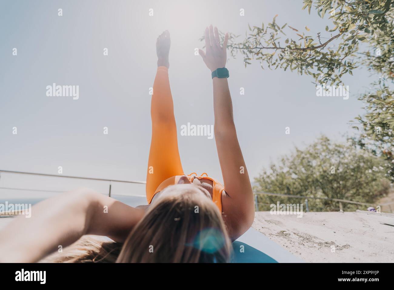 Fitness woman raises arms hi-res stock photography and images - Alamy
