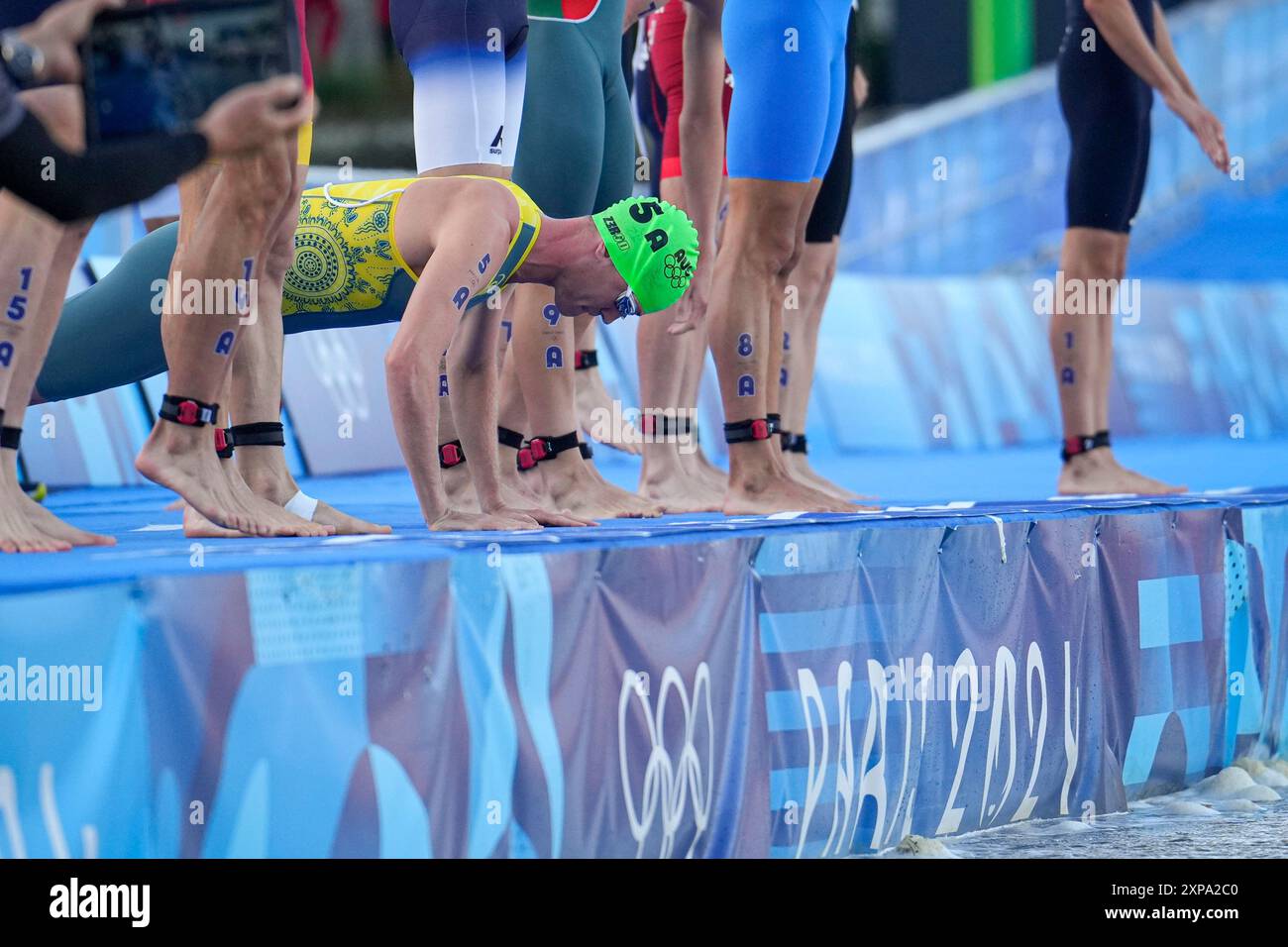 Australia's Luke Willian warms up before diving into the water for the ...