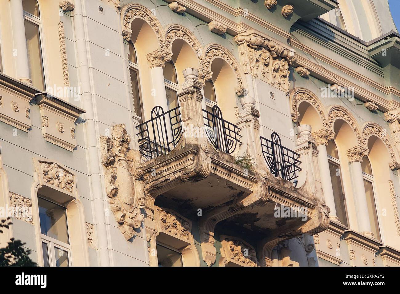 Beautiful facade with a balcony of a classical style building ...
