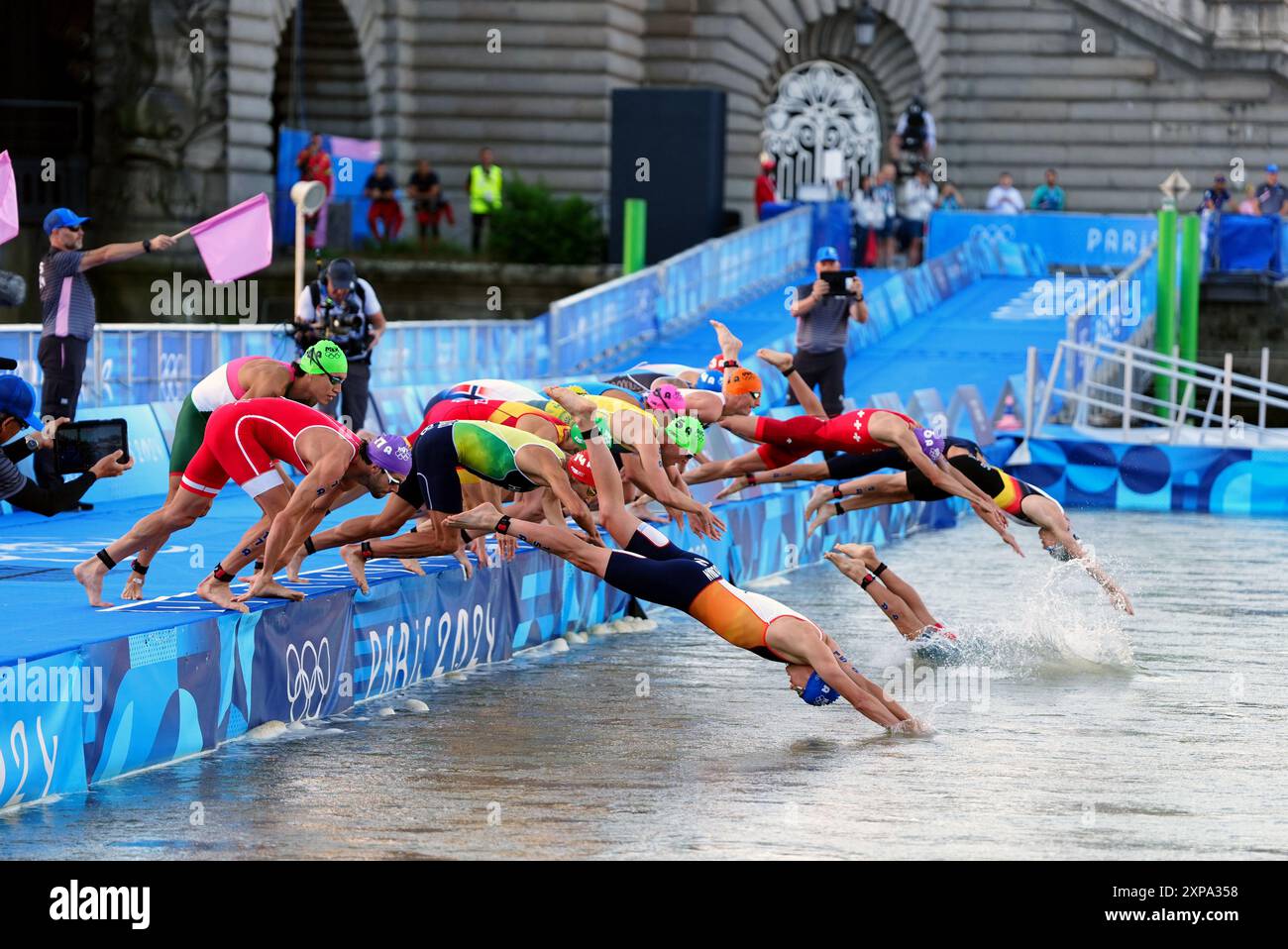 Athletes enter the River Seine at the start of the Mixed Relay ...