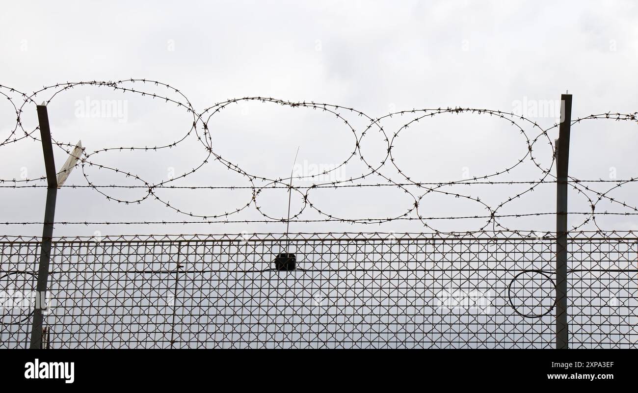 Barbed wire isolated on white background Stock Photo - Alamy