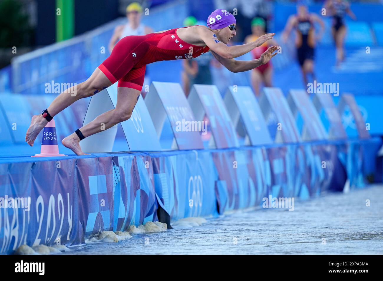 Switzerland's Julie Derron dives into the water for the start of the ...
