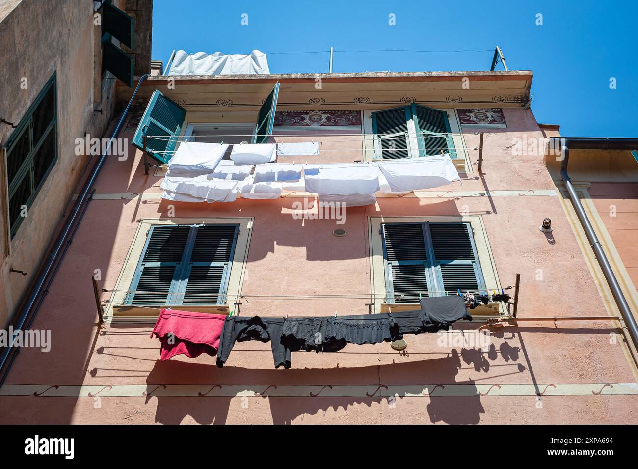 Classic view of drying laundry on clotheslines at traditional Italian ...