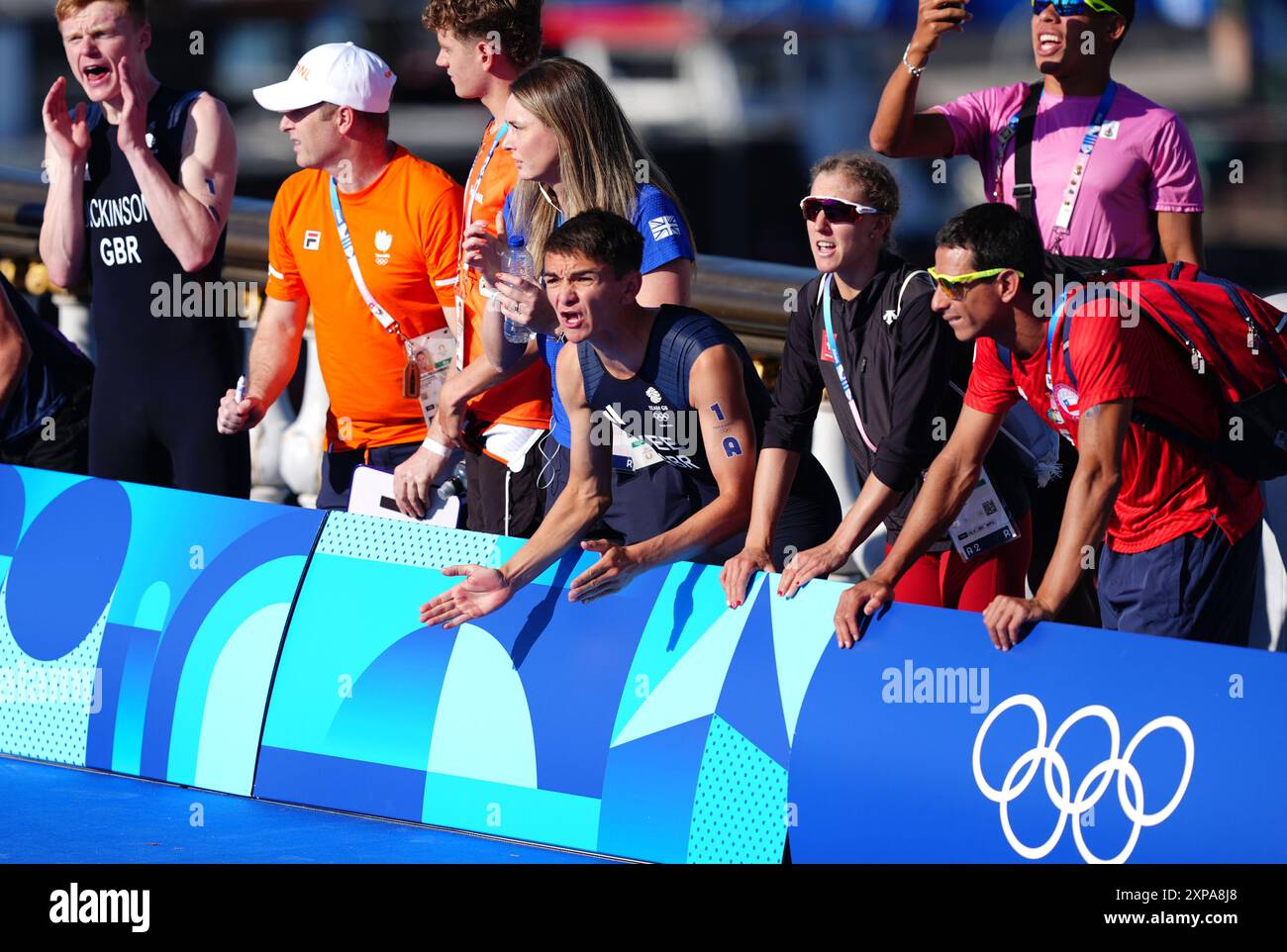 Great Britain's Alex Yee and Samuel Dickinson (left) show their support ...