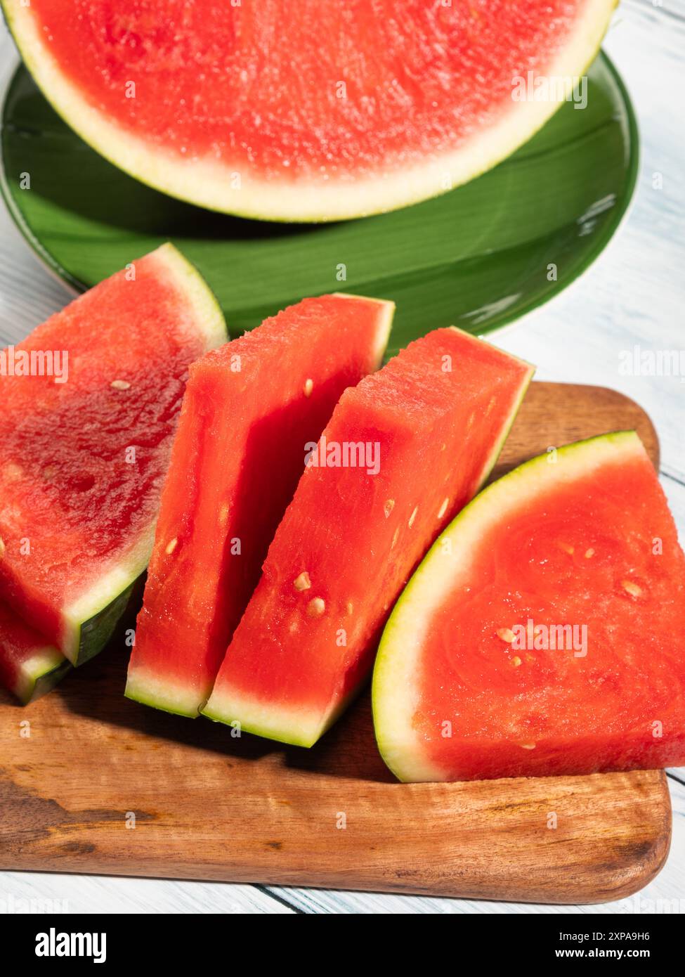 Seedless watermelon slices on wooden background, summer fruit Stock Photo - Alamy