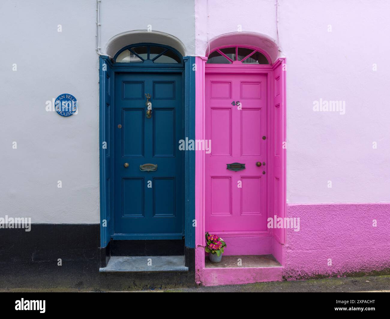 Front doors of two terraced cottages in the coastal village of ...