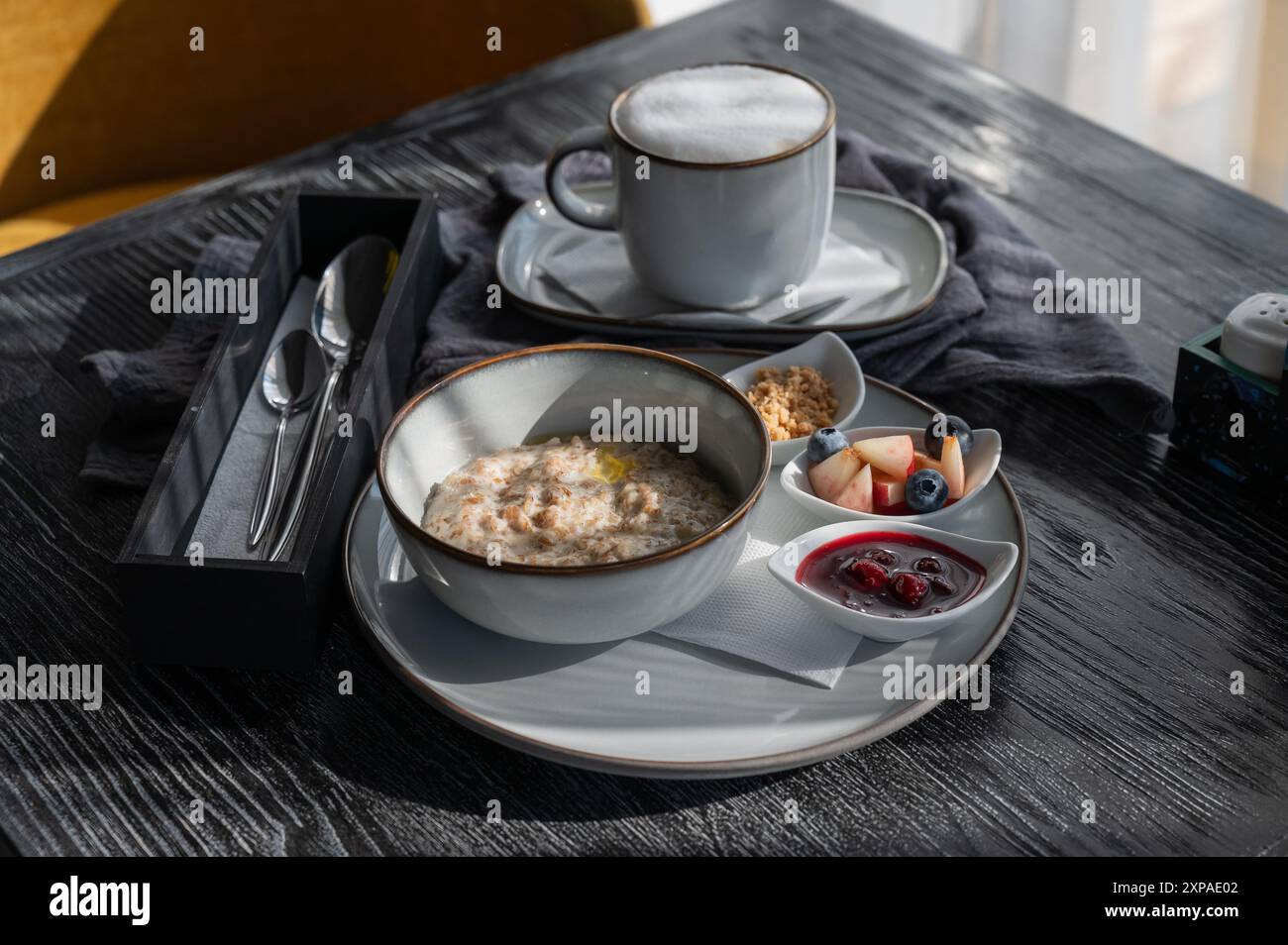 Porridge and coffee. Served breakfast in a cafe Stock Photo - Alamy