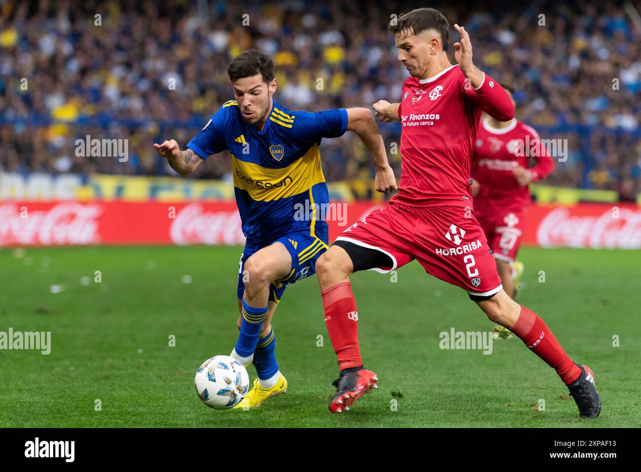 Agustin Alberto Martegani of Boca Juniors and Nicolas Capraro in action ...