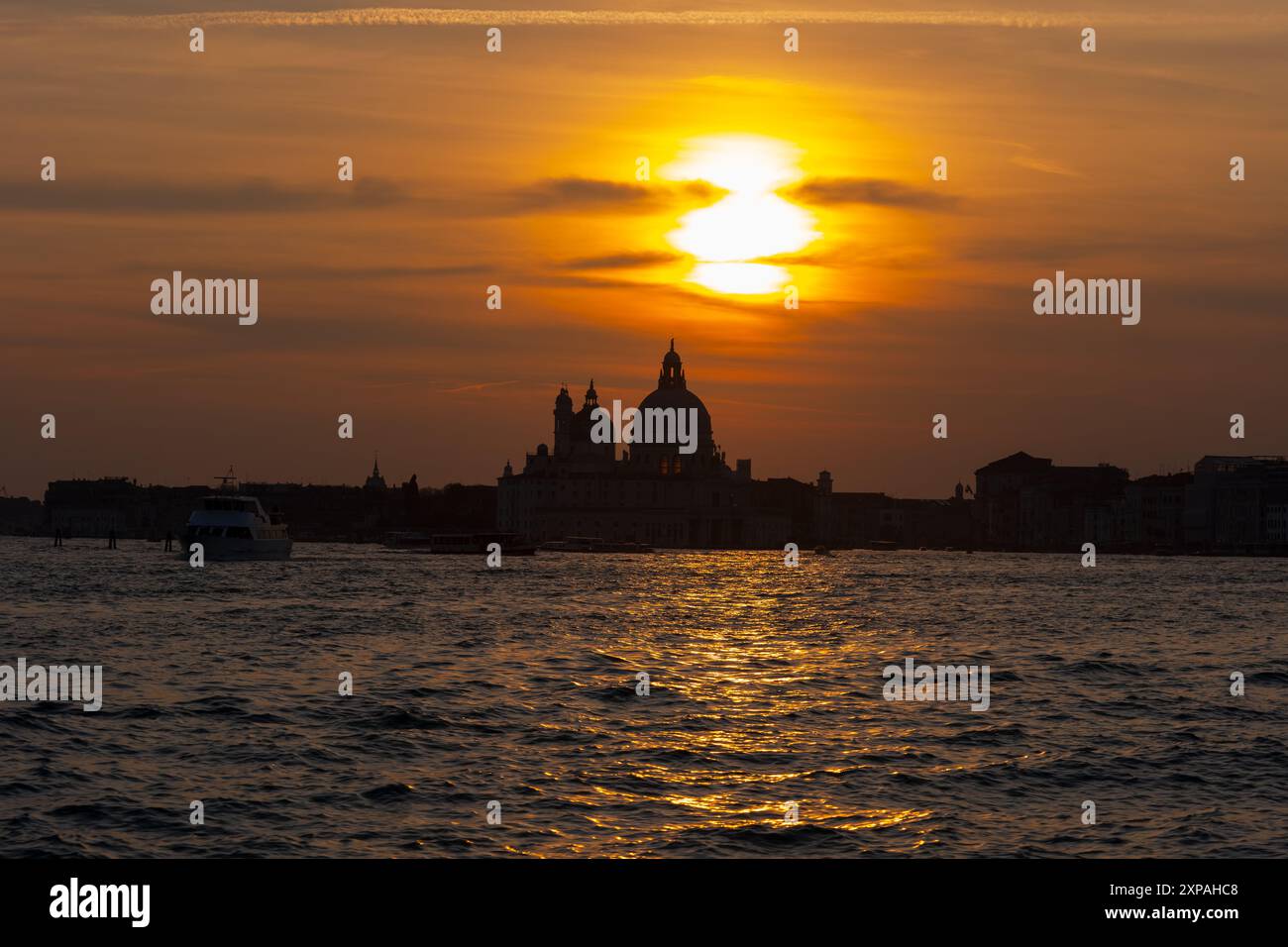 City of Venice at sunset in Italy, skyline silhouette from the Venetian ...