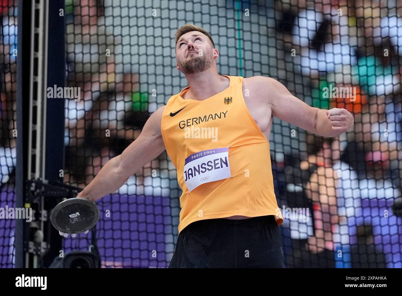 Henrik Janssen, of Germany, competes during the men's discus throw ...