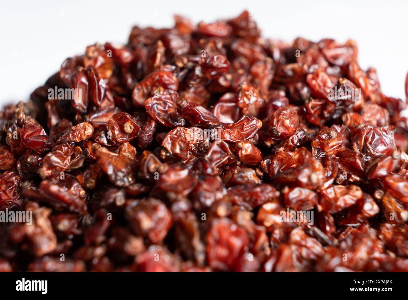Red dried barberry on white background Stock Photo - Alamy